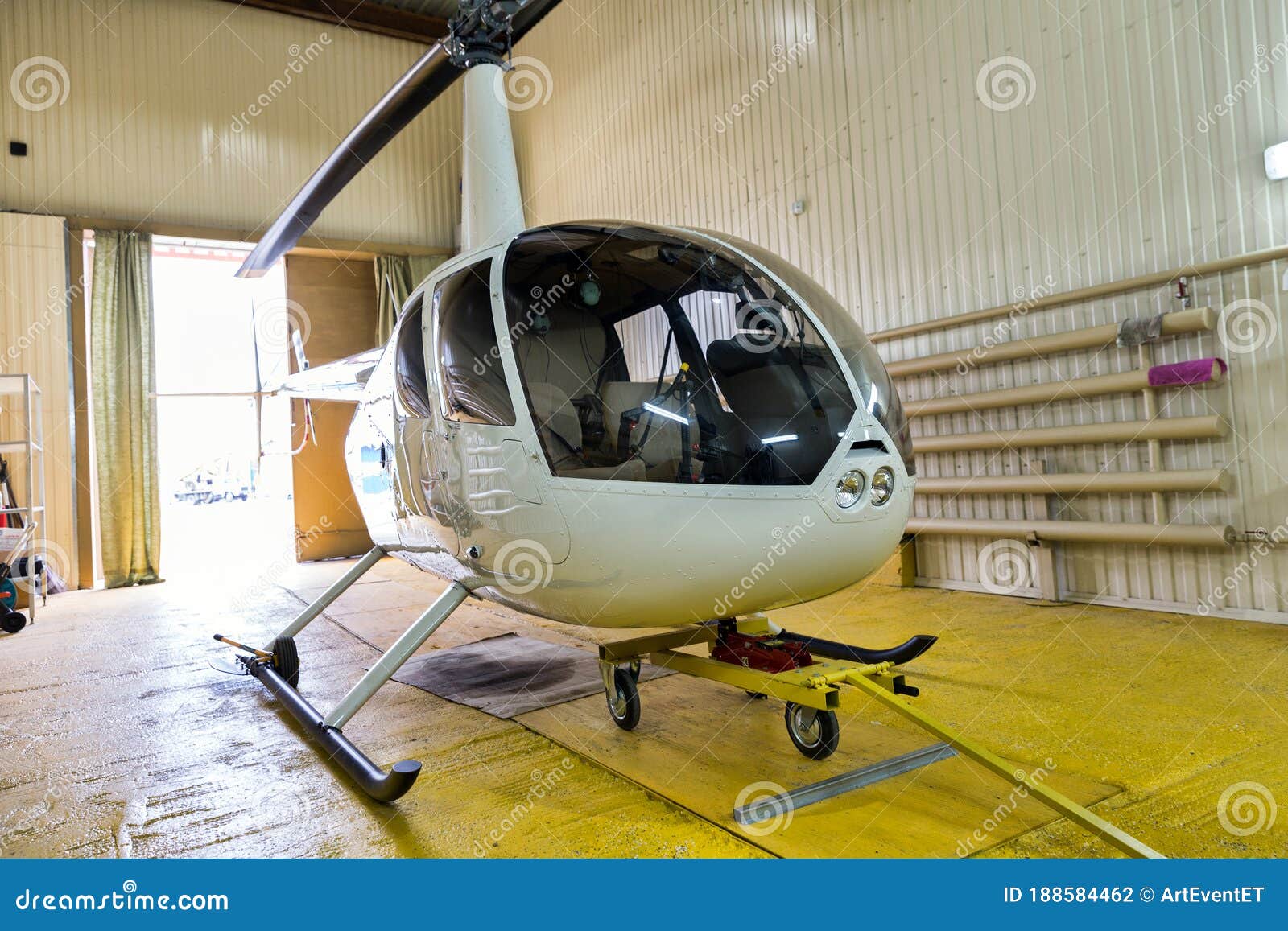 Helicopter in hangar stock photo. Image of flier, yellow - 188584462