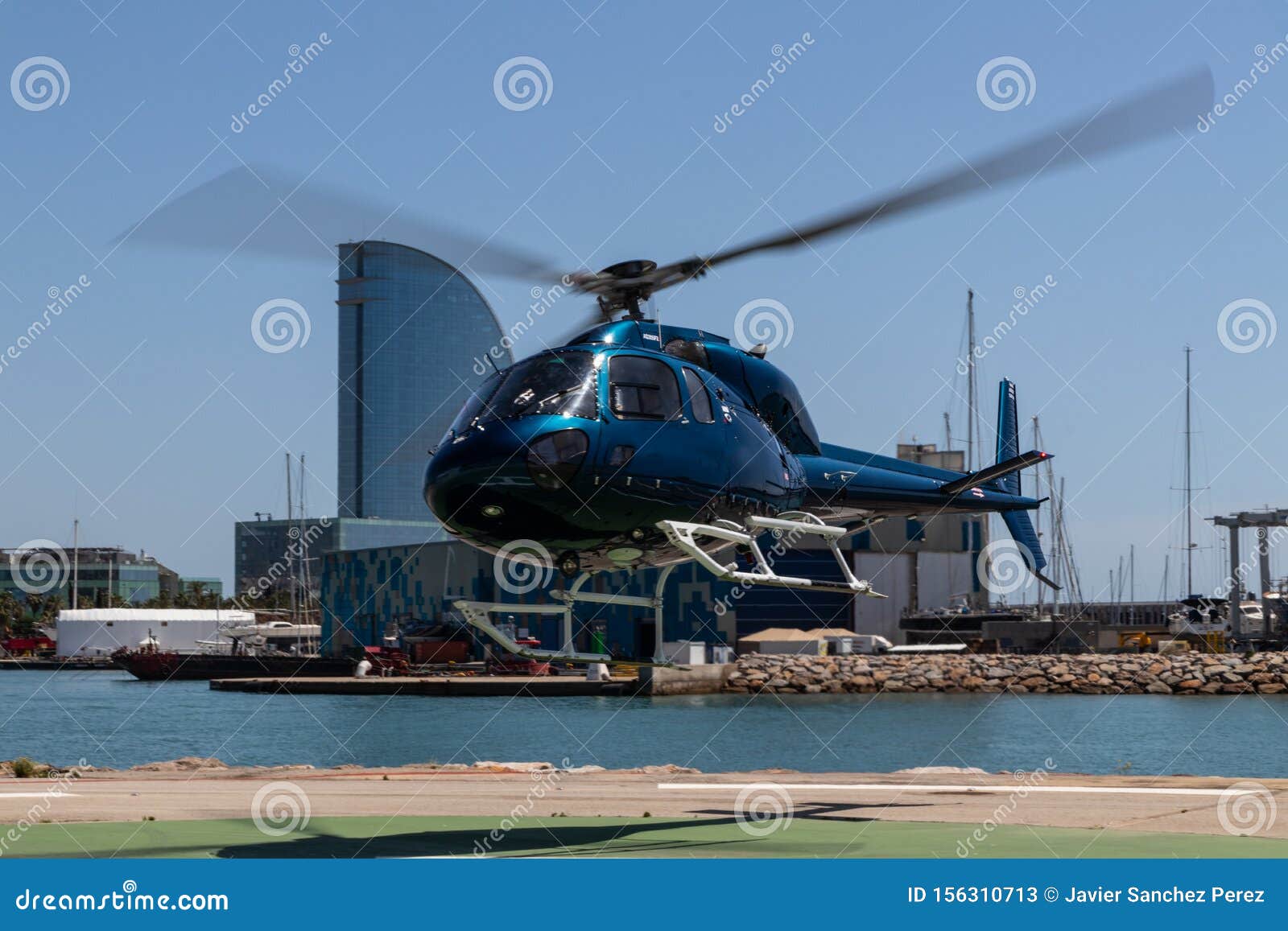 The Helicopter Landing Officer Loading Baggage To Helicopter At ...
