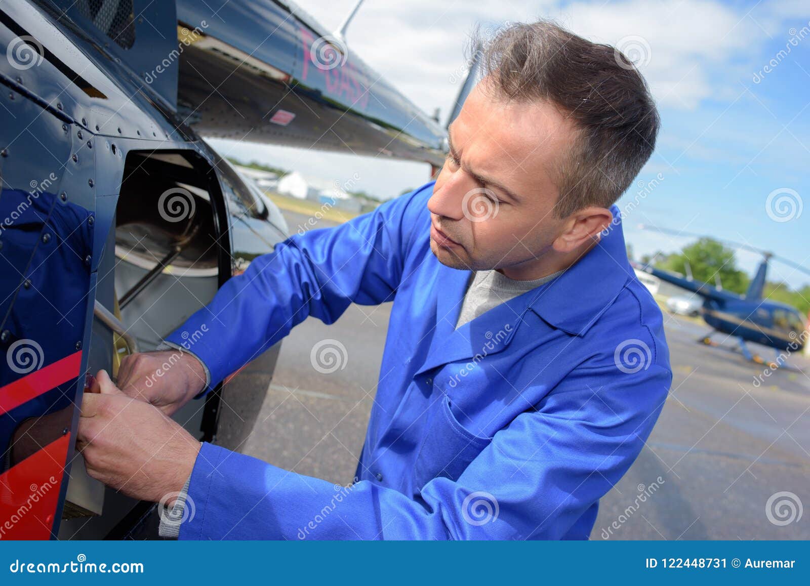 Helicopter Mechanic at Work Stock Image - Image of working, fixing ...