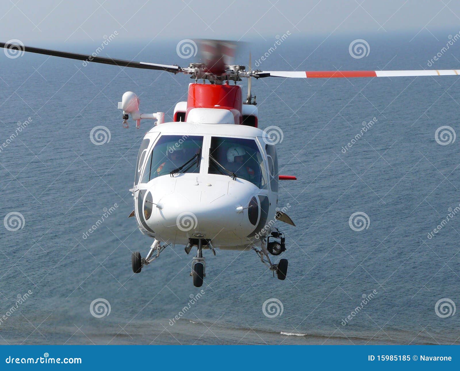 Helicopter in Midair Over Sea Stock Image - Image of hovering ...