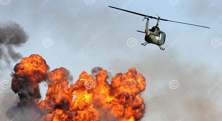 Helicopter over explosion stock image. Image of flying - 12816131