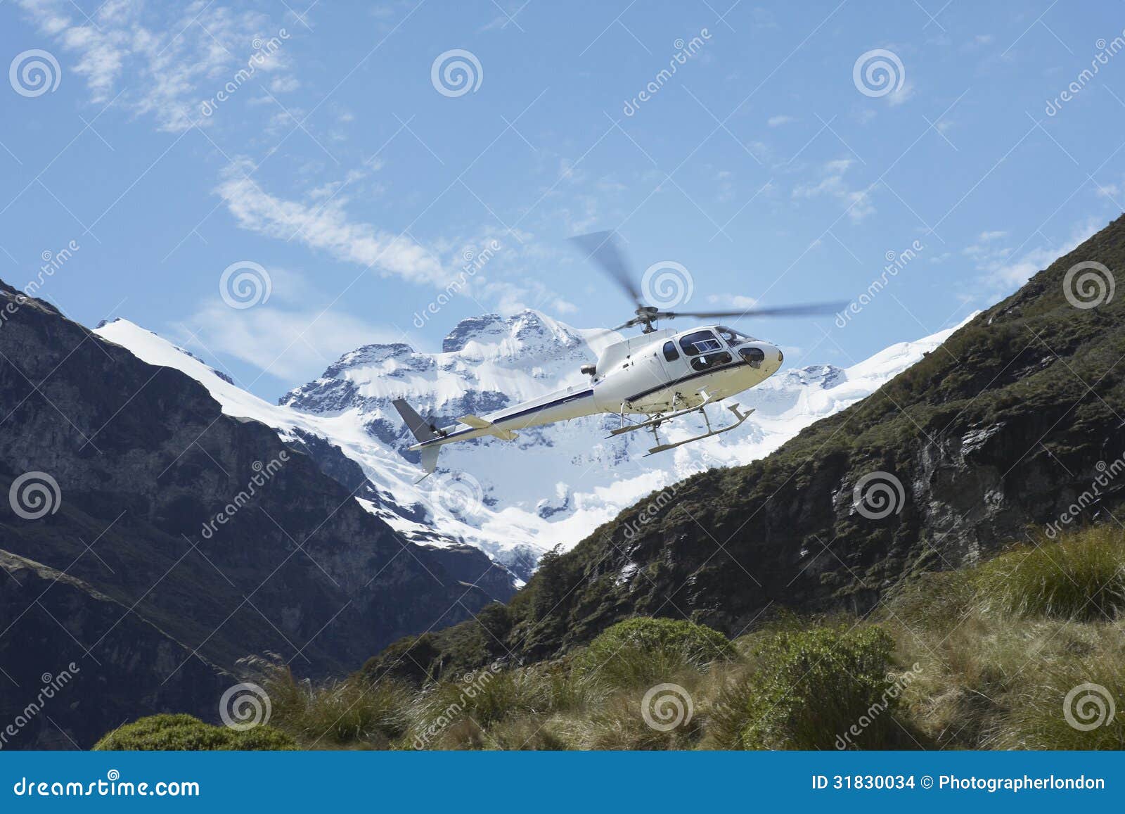 Helicopter Over Mountains stock photo. Image of peak - 31830034