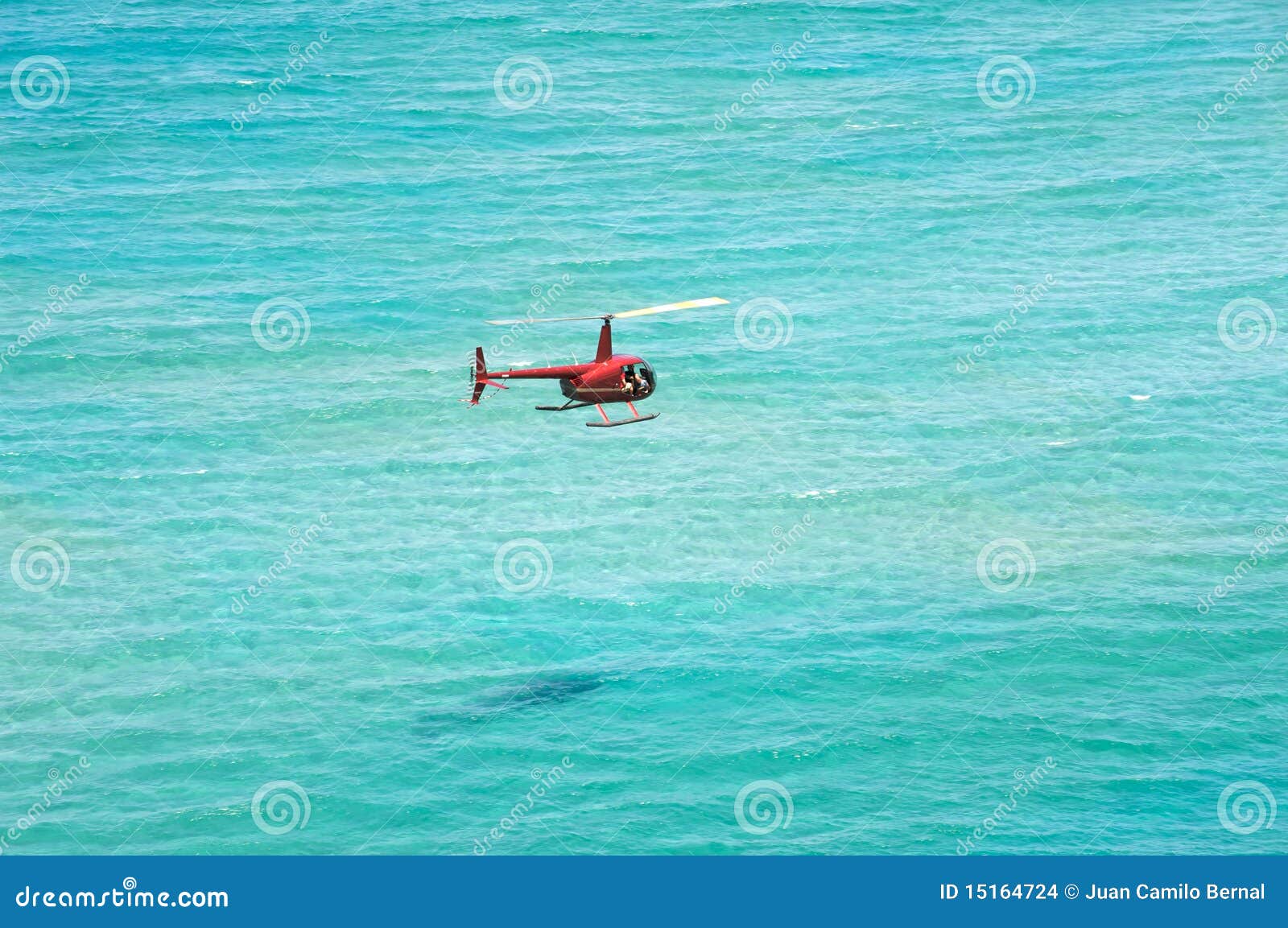 Helicopter over the ocean stock photo. Image of flying - 15164724