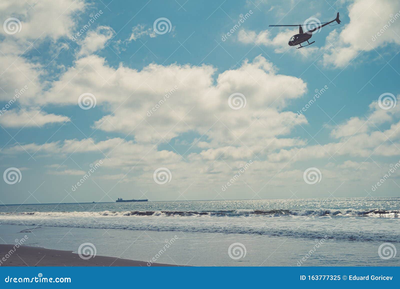 Helicopter Patrols Over the Ocean Beach Stock Image - Image of coast ...