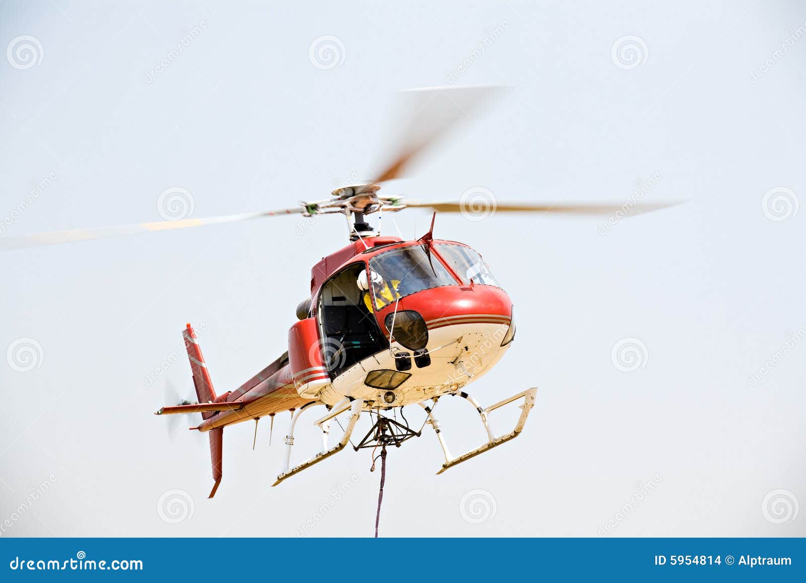 Helicopter Picking Up Cargo Stock Photo - Image of helicopter, flying ...