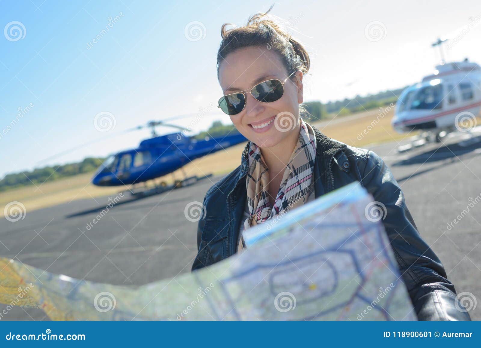Helicopter Pilot Looking at Map on Runway Stock Image - Image of young ...