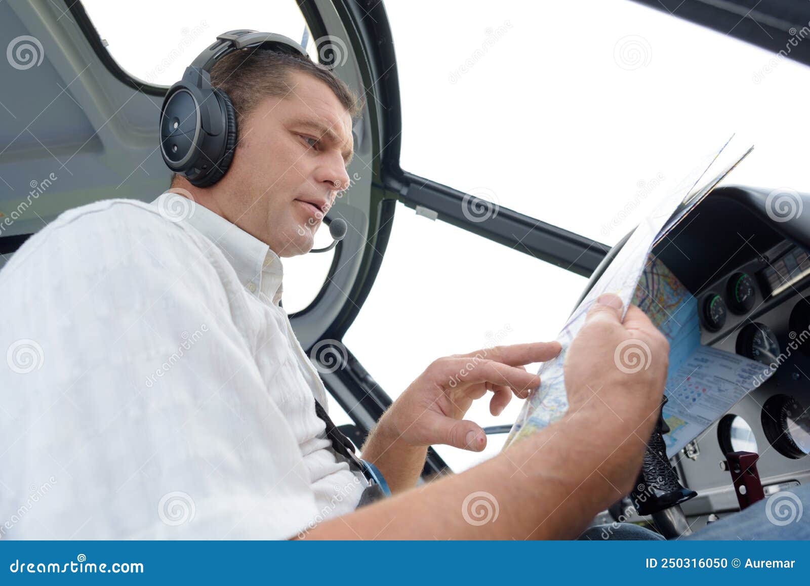 Helicopter pilot reading stock photo. Image of captain - 250316050