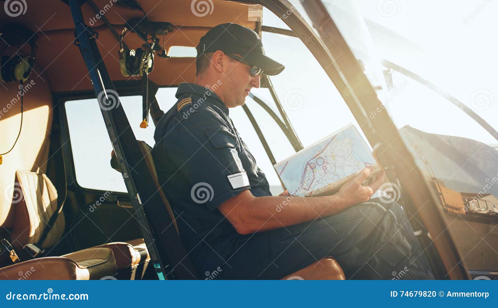 Helicopter Pilot Reading Flight Map Stock Photo - Image of commercial ...