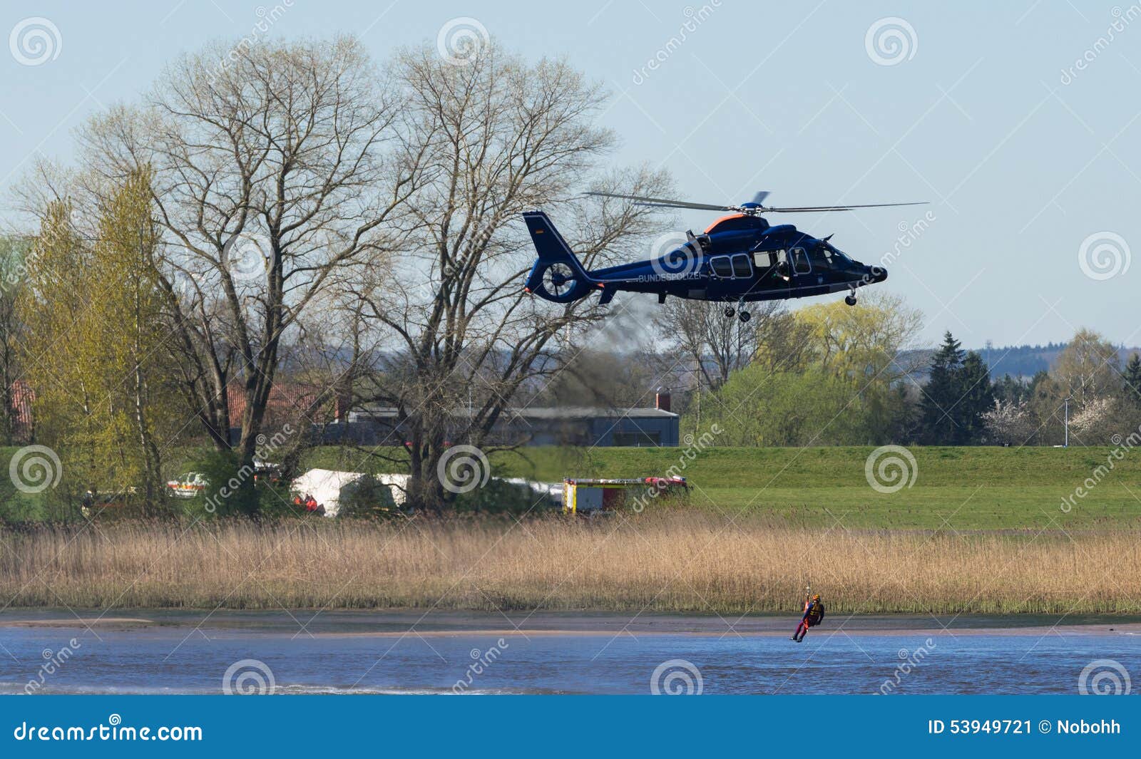 A Helicopter rescue a man editorial photo. Image of helicopters - 53949721