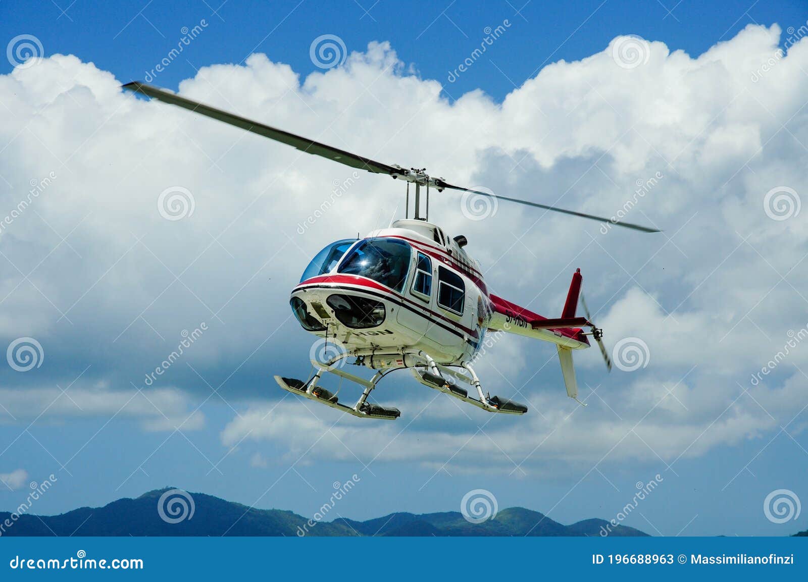 Helicopter on Scenic Flight with Clouds and Blue Sky Editorial Stock ...