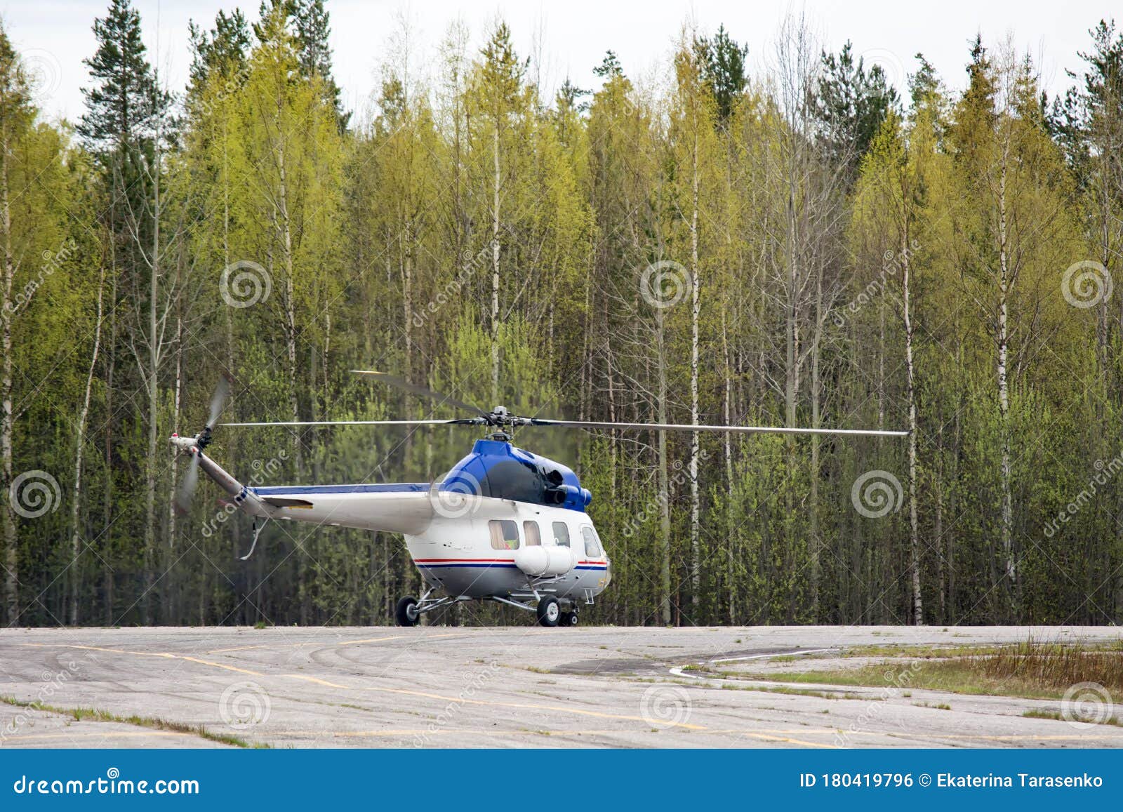 Helicopter Stands on the Runway Stock Photo - Image of blue, field ...