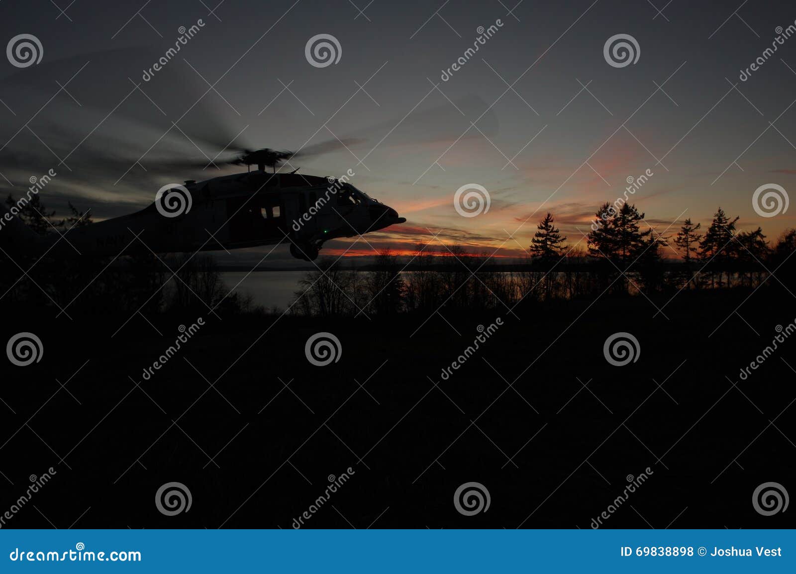 Helicopter at Sunset stock photo. Image of sunset, orange - 69838898