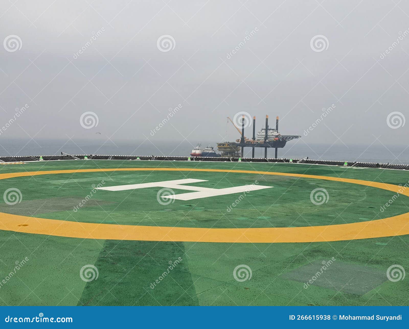 Helideck with Background View of Rig, Platform, and 2 Vessel in the ...