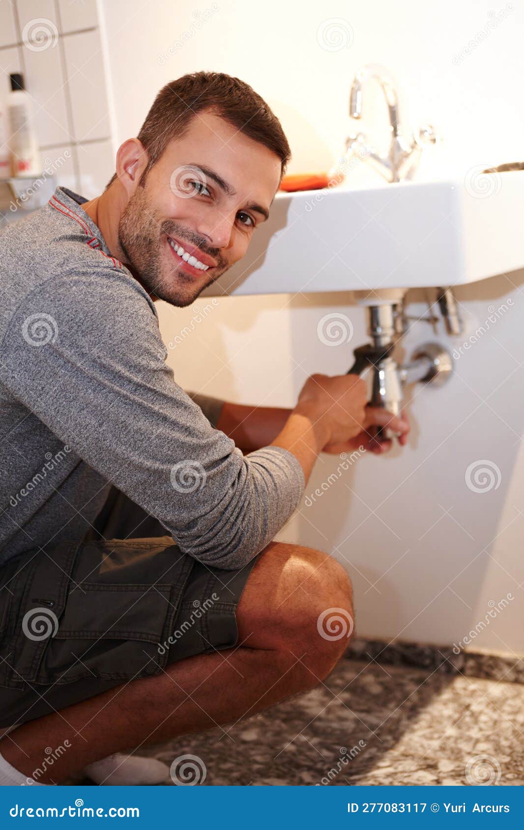 Hell Patch Up those Pipes. Portrait of an Attractive Young Man Fixing a ...
