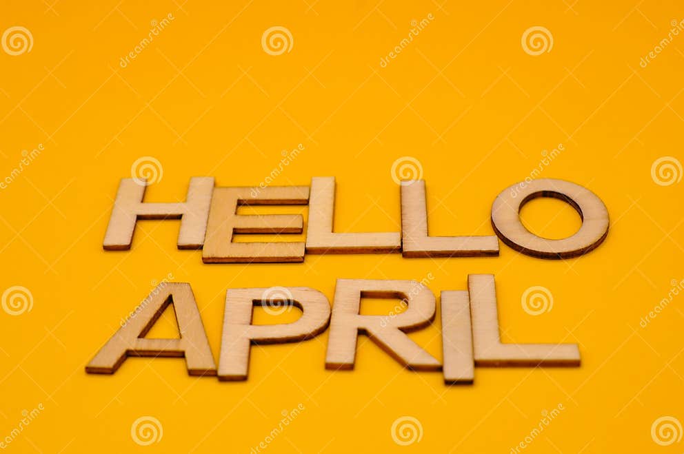 Hello April Write on Yellow Background Stock Photo - Image of font ...