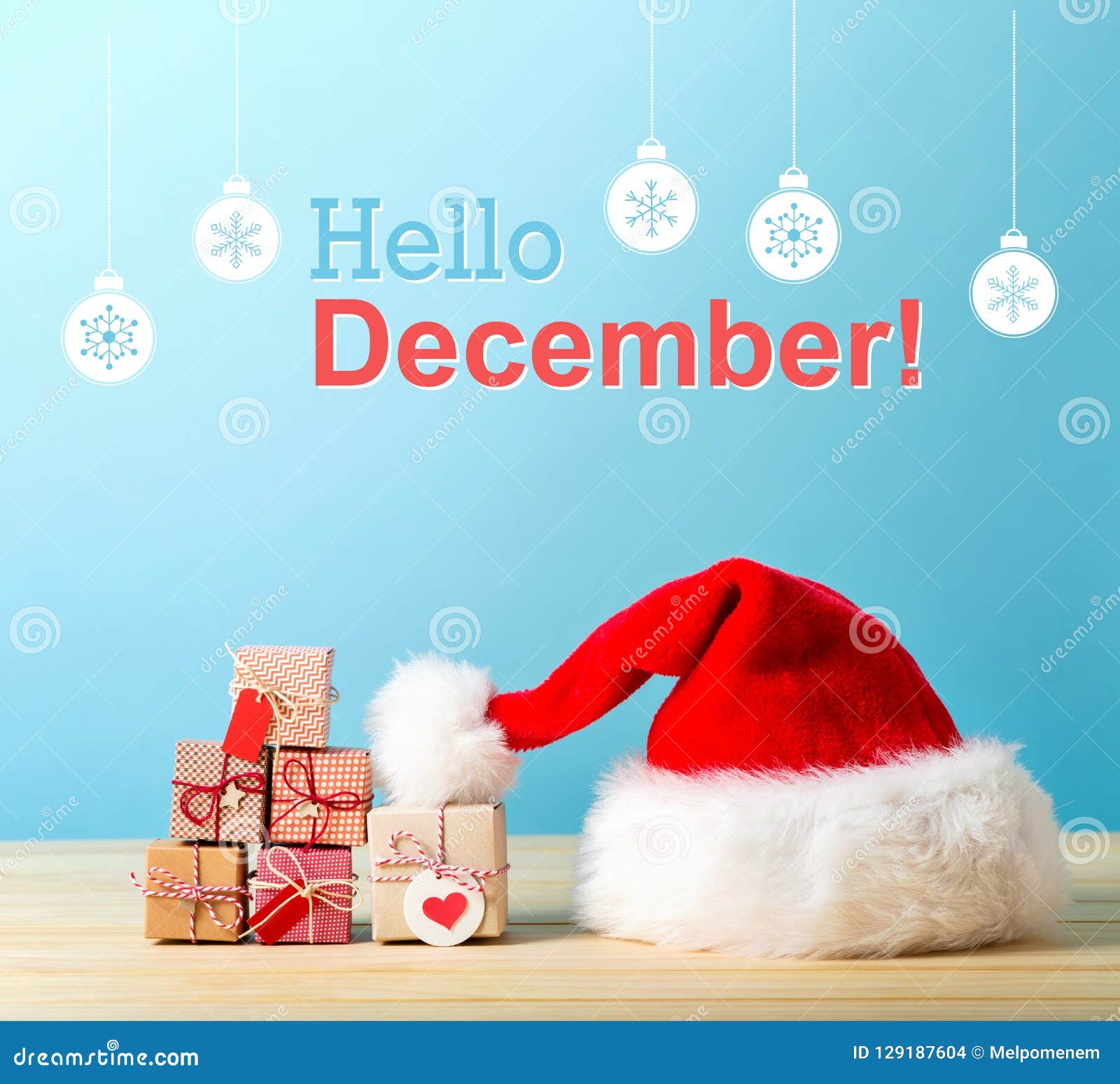 Hello December Message with a Santa Hat and Gift Boxes Stock Photo ...