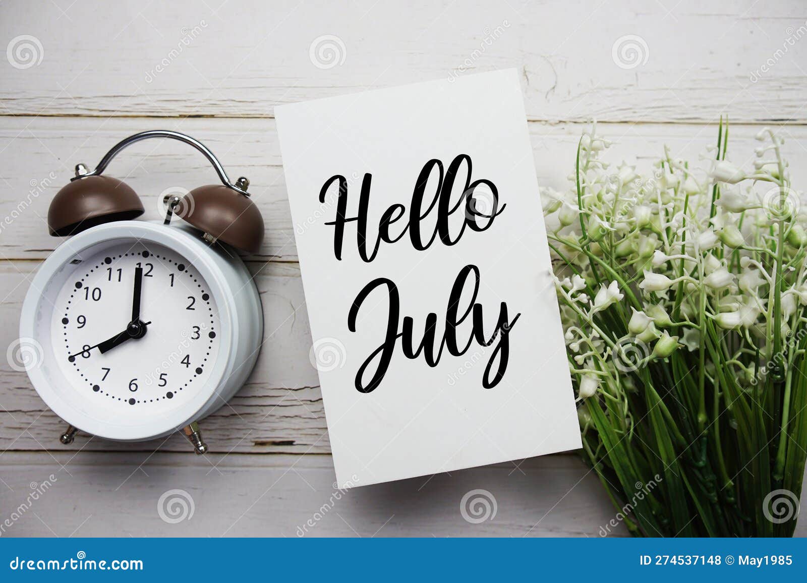 Hello July Text Message with Flower and Alarm Clock on Wooden ...