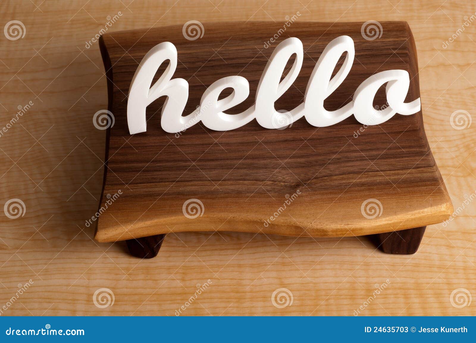 Hello on Mahogany Table stock image. Image of close, word - 24635703