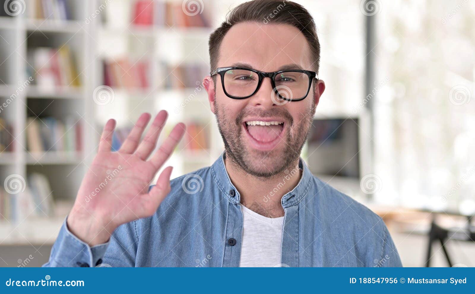 Hello, Young Man in Glasses Waving at Camera Stock Photo - Image of ...