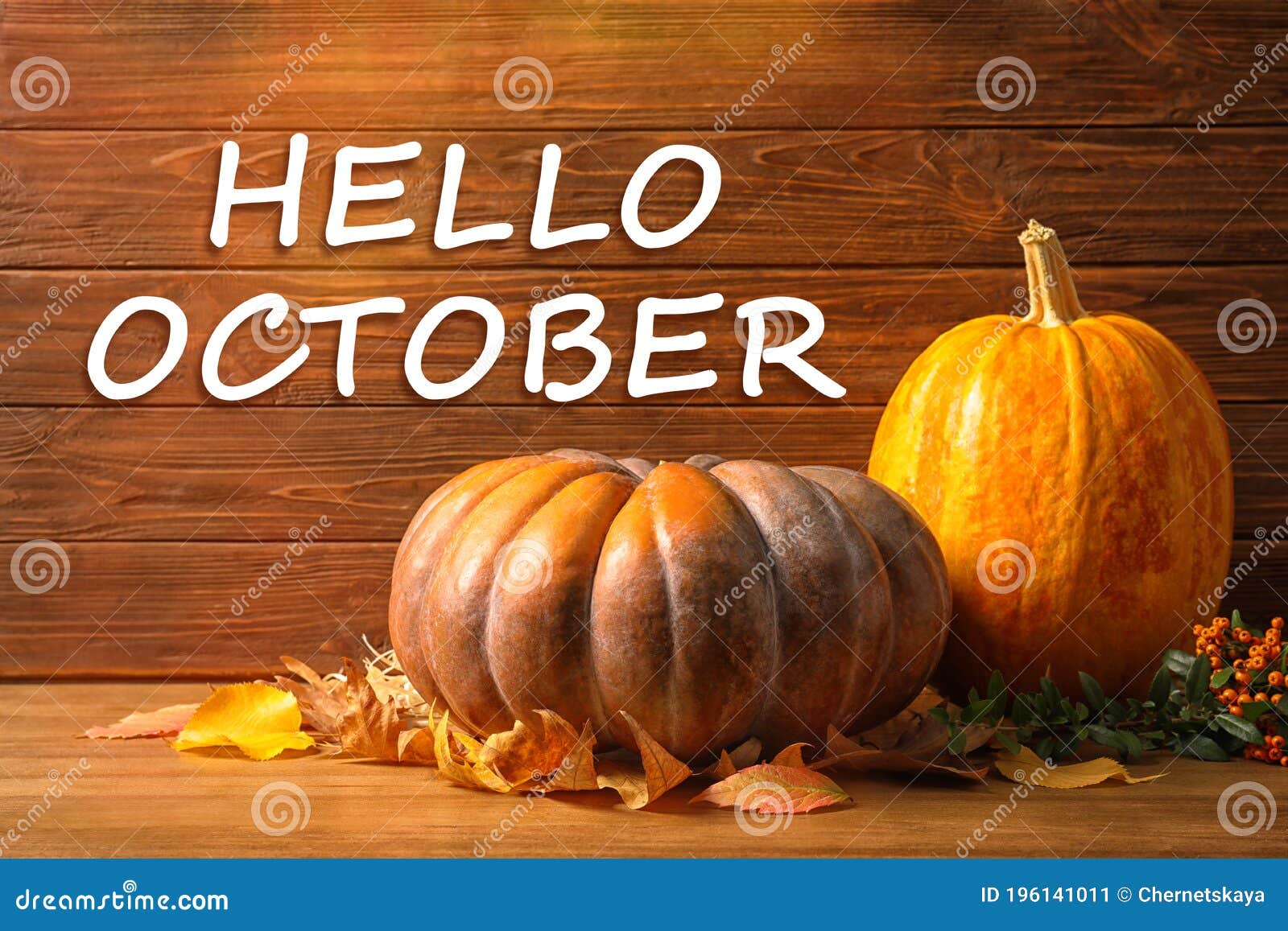 Hello October Card. Pumpkins and Dry Leaves on Wooden Table Stock Image ...