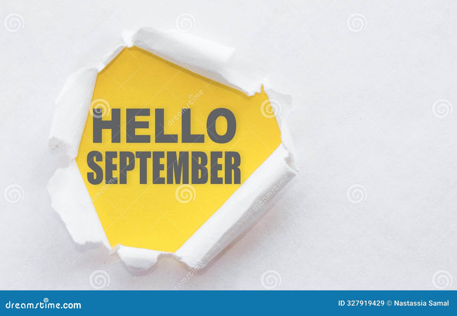 Hello September Text on Yellow Paper through Torn White Paper Stock ...