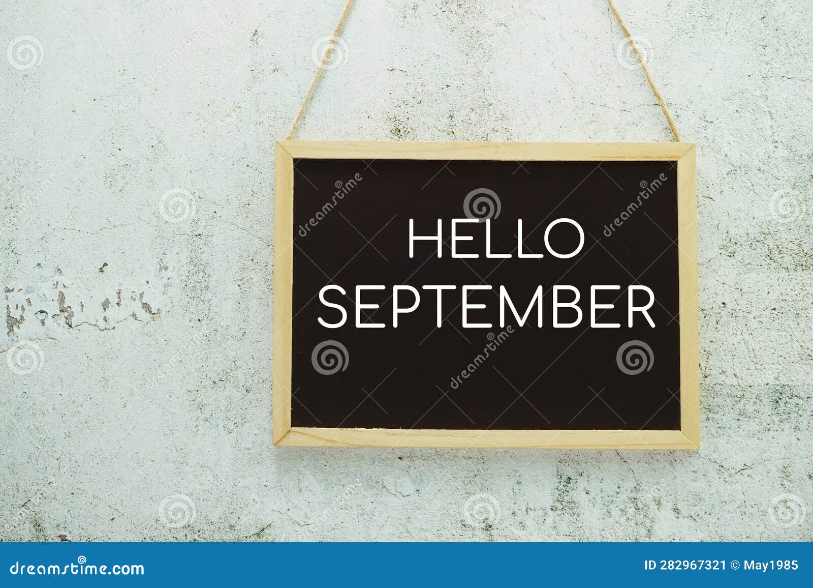 Hello September Typography Text on Blackboard Hanging Against on the ...