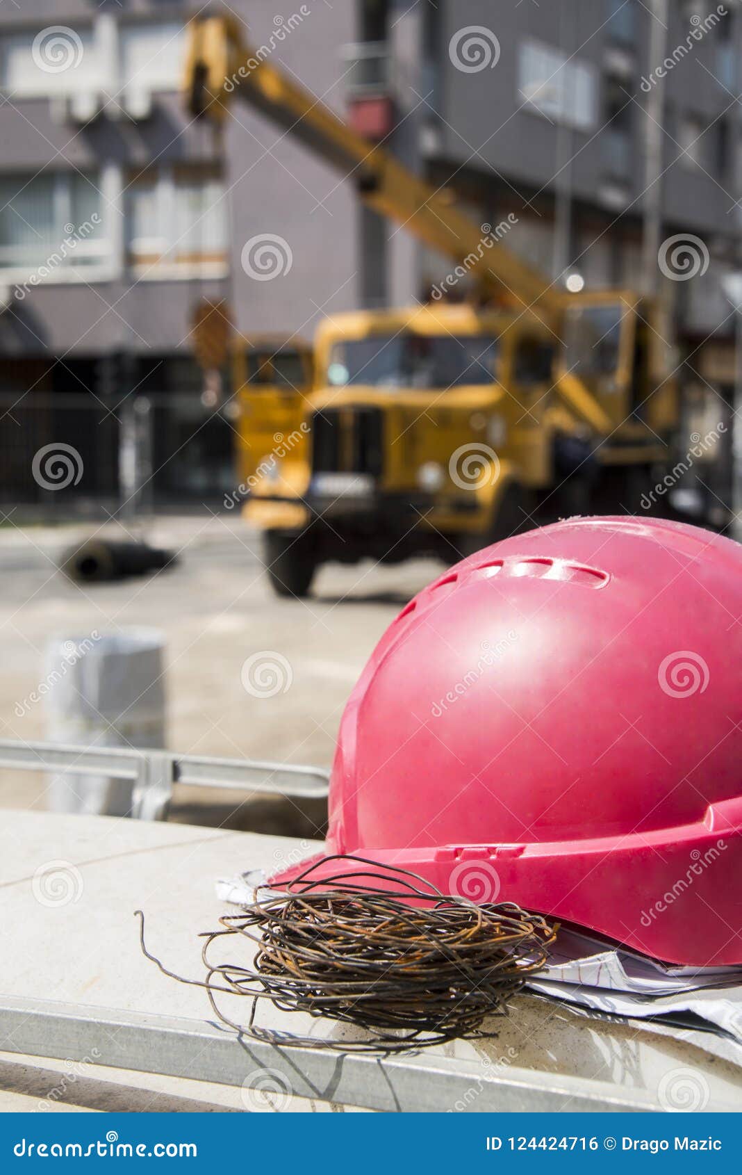 The Helmet on the Construction Plans and Buildings in the Background ...
