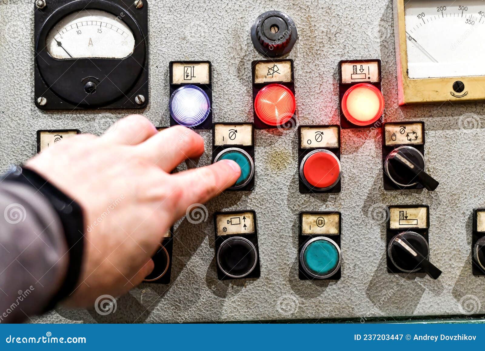 With the Help of the Control Panel from the CNC Machine, the Man Gives ...