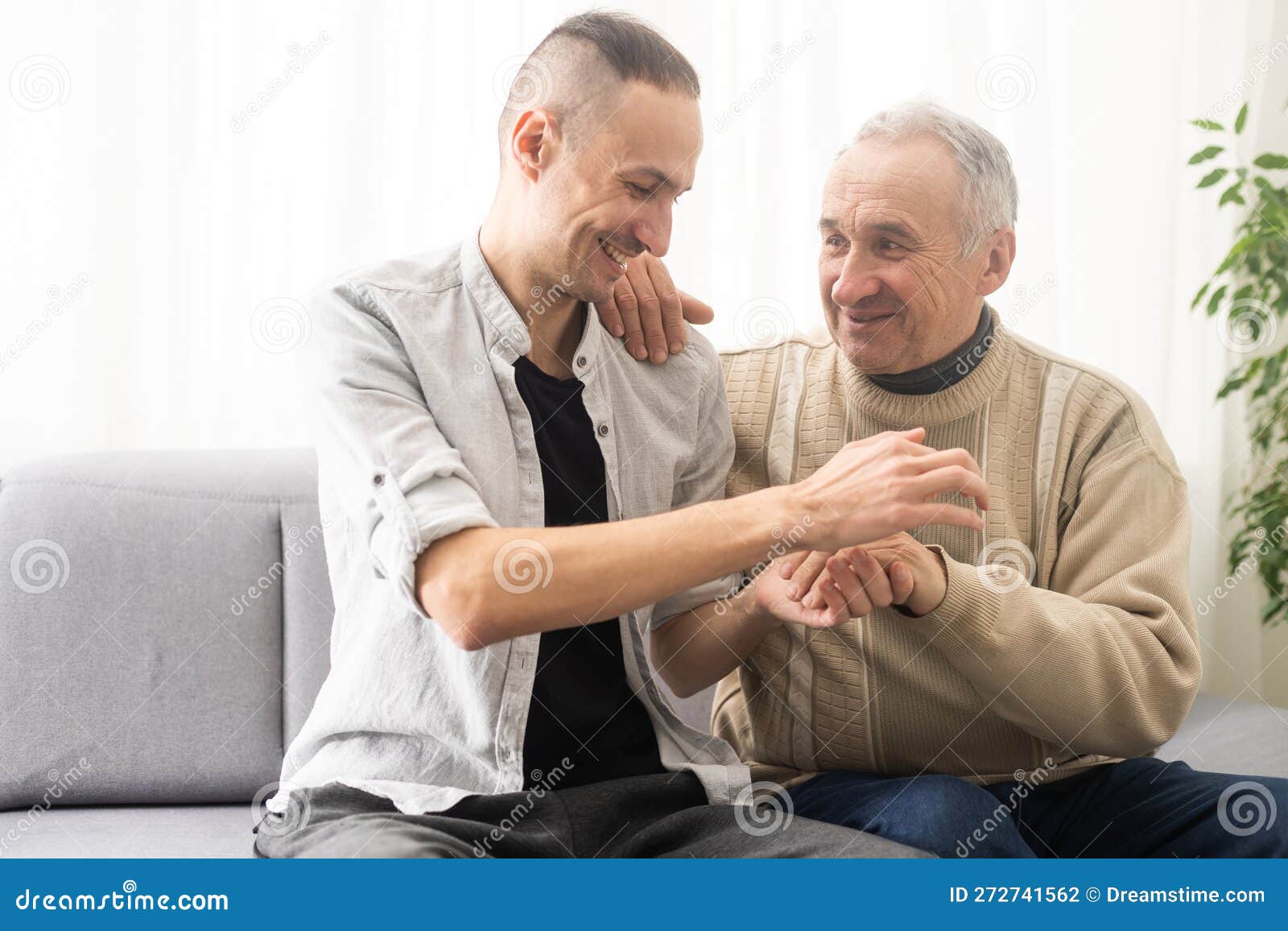 Help Needed. Pleasant Senior Man Sitting on the Sofa Stock Photo ...