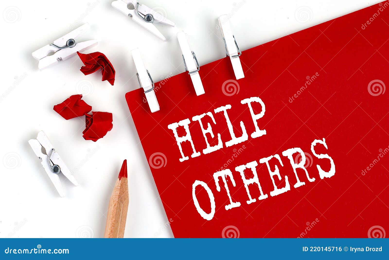 HELP OTHERS Text on Red Paper with Office Tools on White Background ...