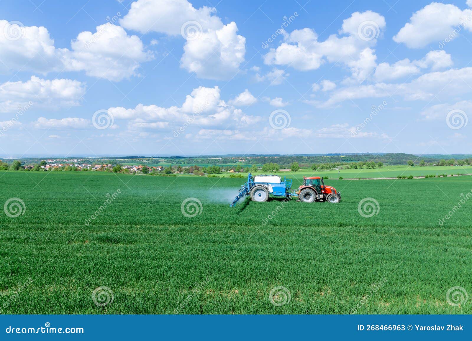Feld is Sprayed with Fertilizer or Herbicide Using a Tractor. Stock ...