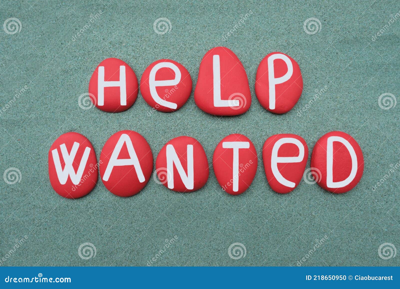 Help Wanted Text Composed with Red Colored Stone Letters Over Green ...