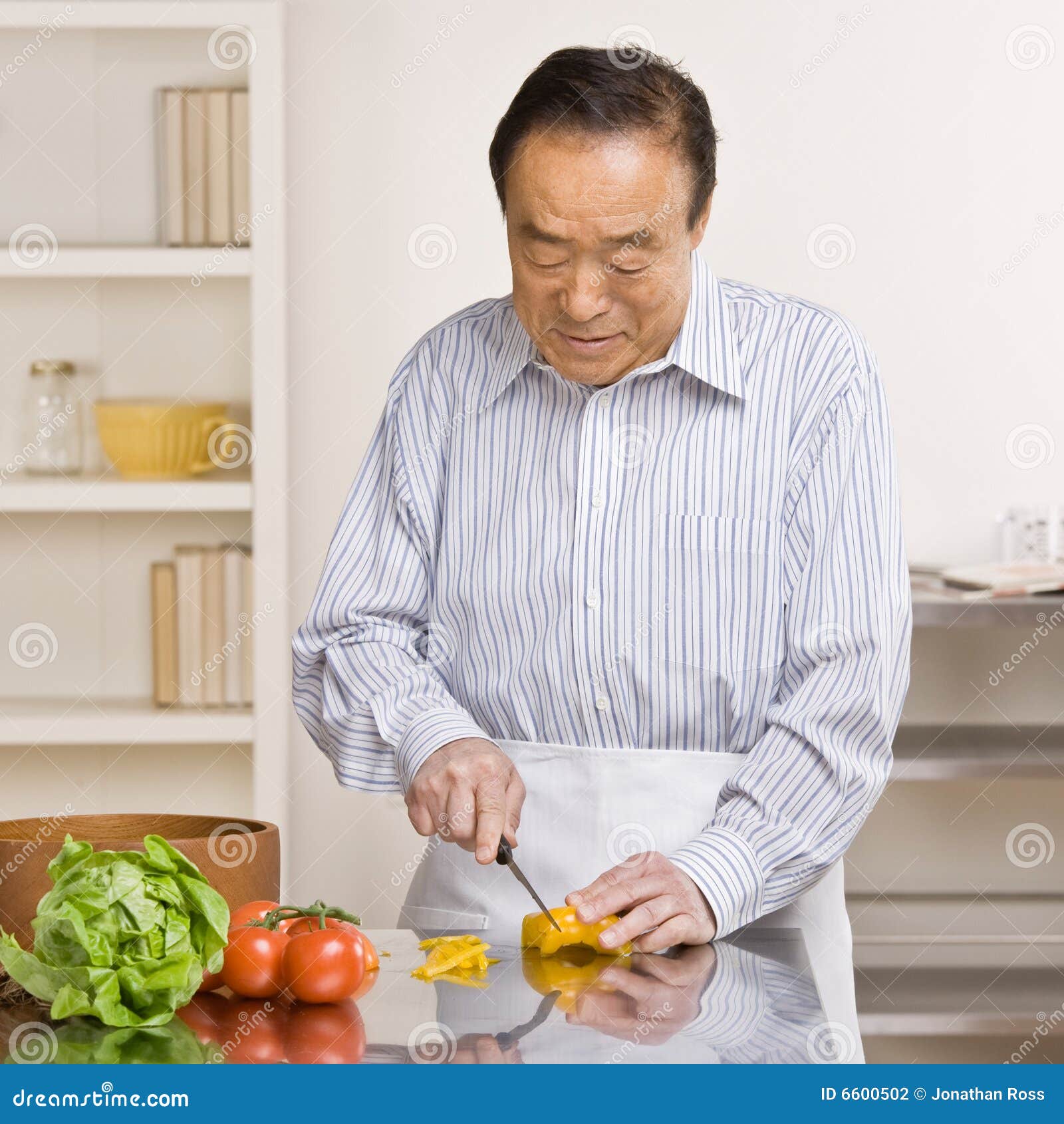 Helpful Man Preparing Salad in Kitchen for Dinner Stock Photo - Image ...