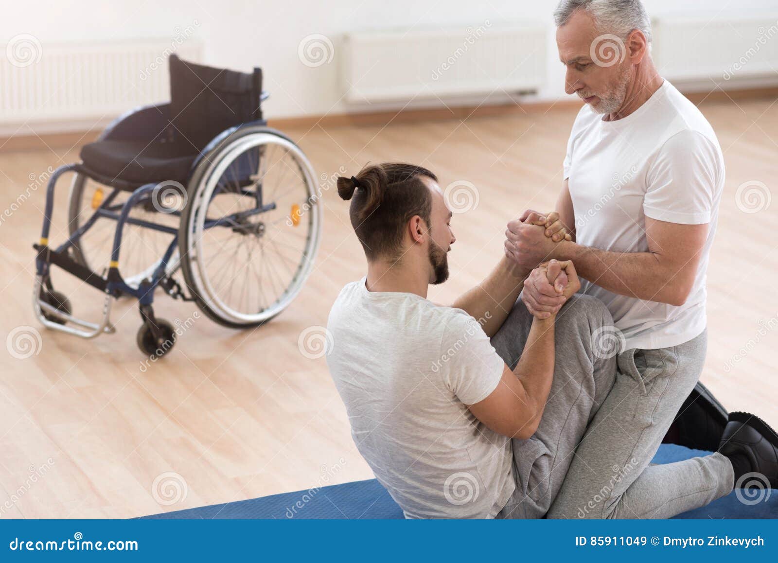 Helpful Orthopedist Assisting the Handicapped in the Gym Stock Image ...