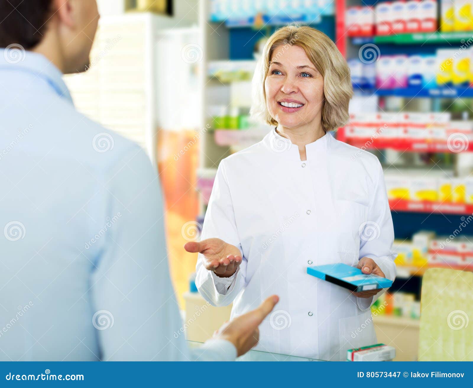 Helpful Pharmacist Serving and Consulting Man Stock Image - Image of ...