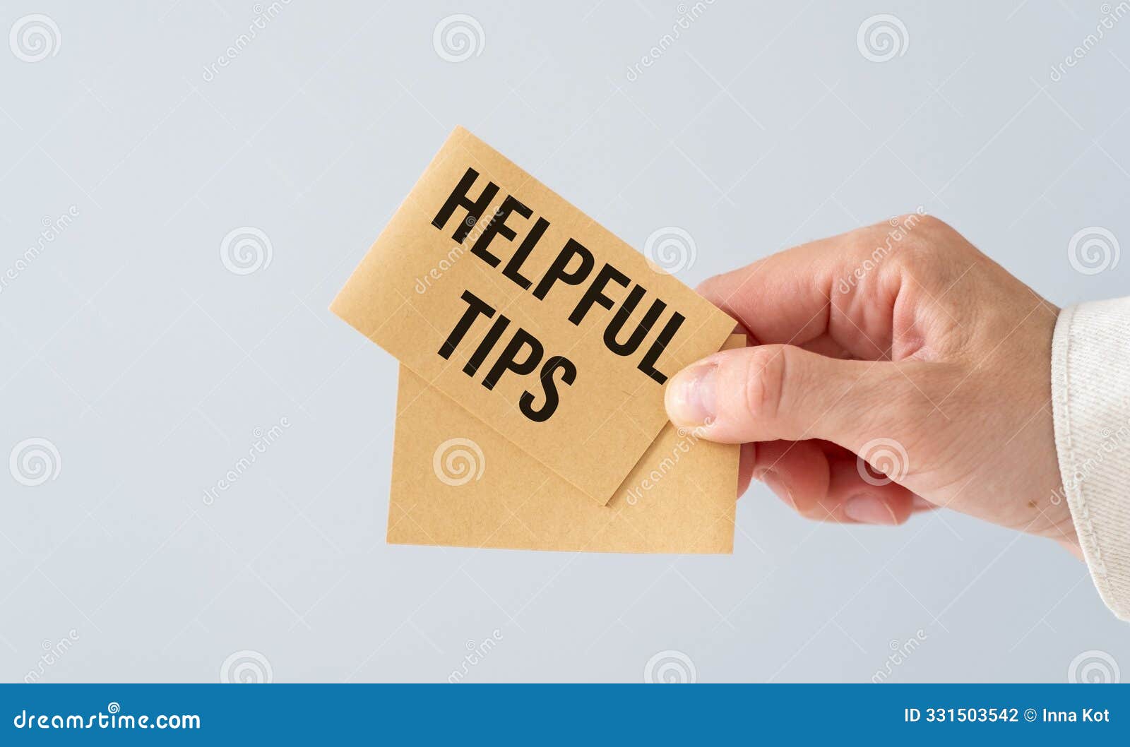 Helpful Tips Text on Stickers in Hand on Light Background. Stock Photo ...