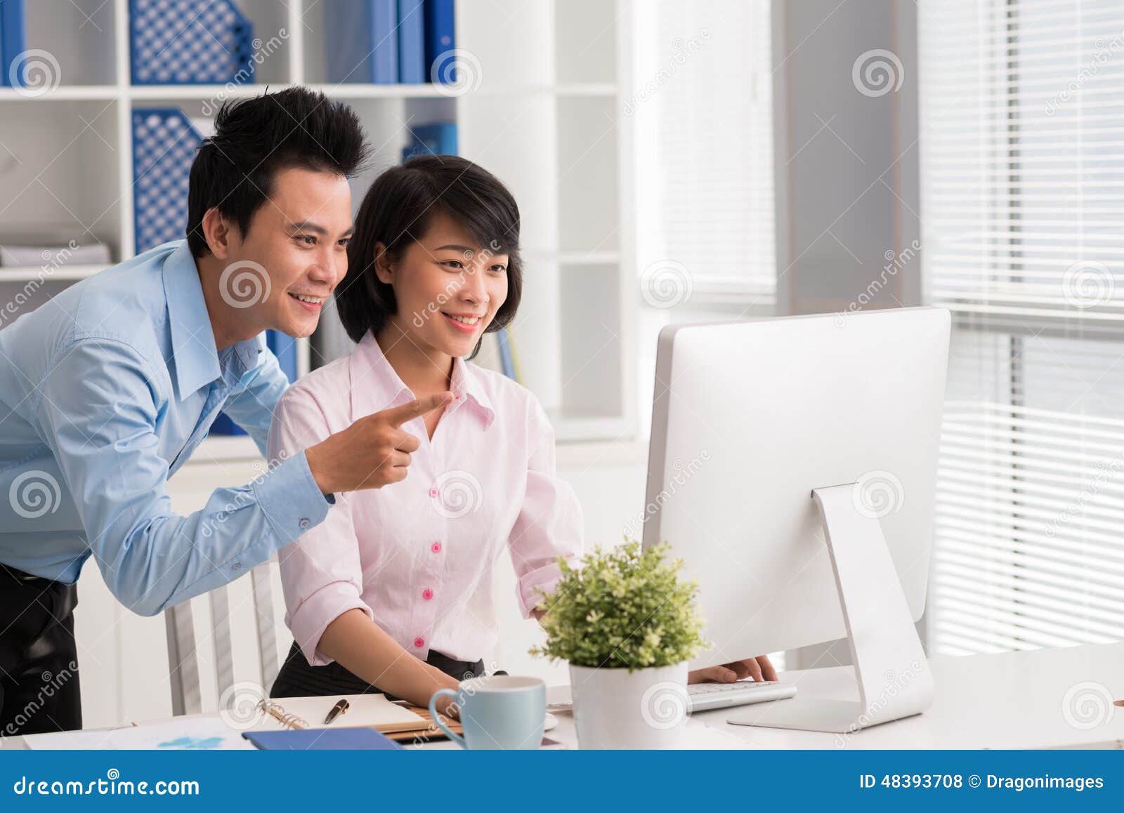 Helping Attractive Colleague Stock Photo - Image of office, smiling ...