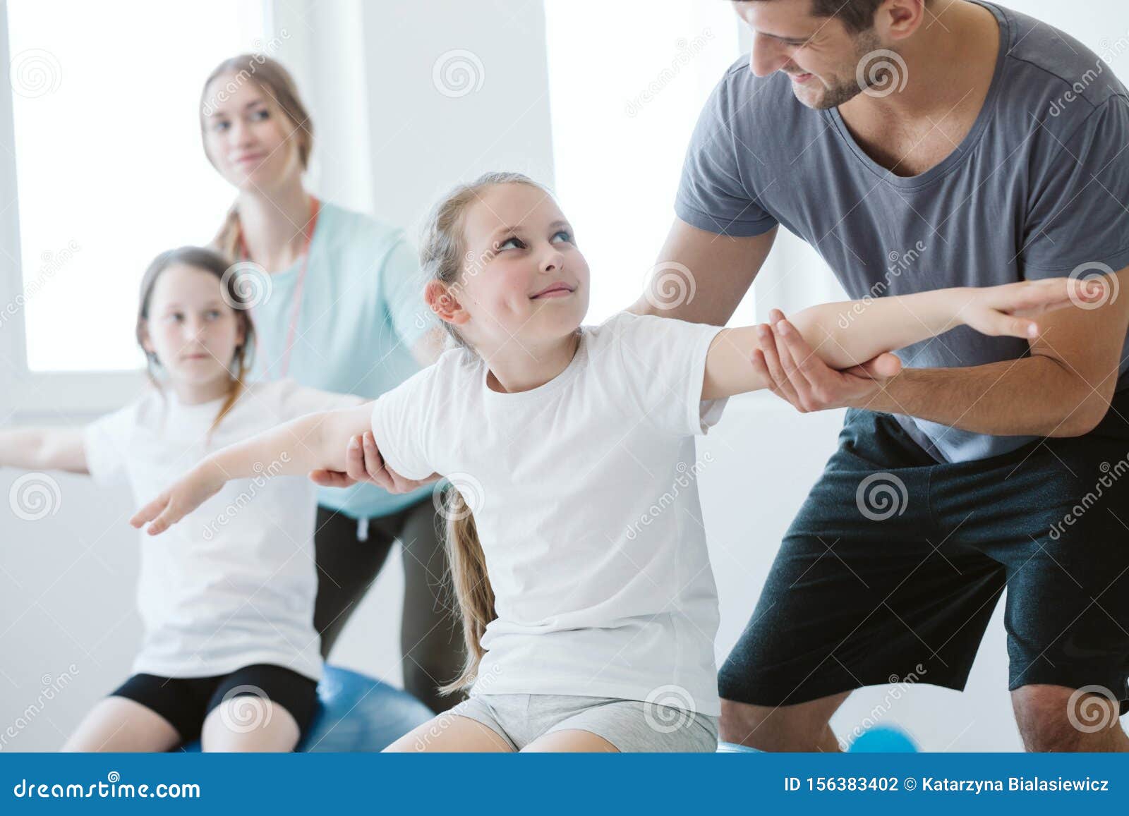 Helping with the exercise stock photo. Image of physical - 156383402