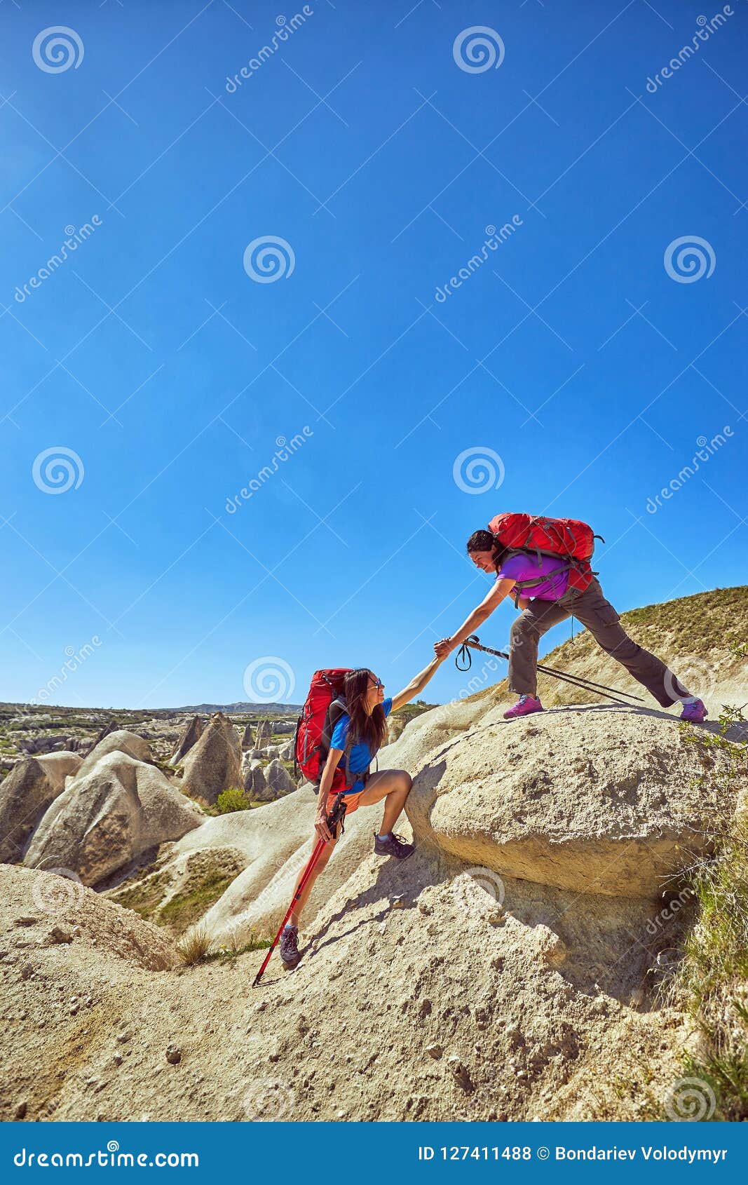 A Helping Hand High in the Mountains in the Summer Hike. Stock Photo ...