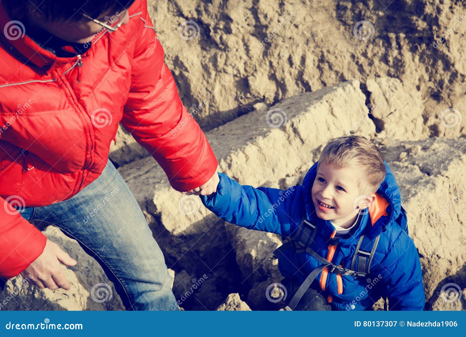 Helping Hand- Little Boy Helped by Father in Mountains Stock Image ...