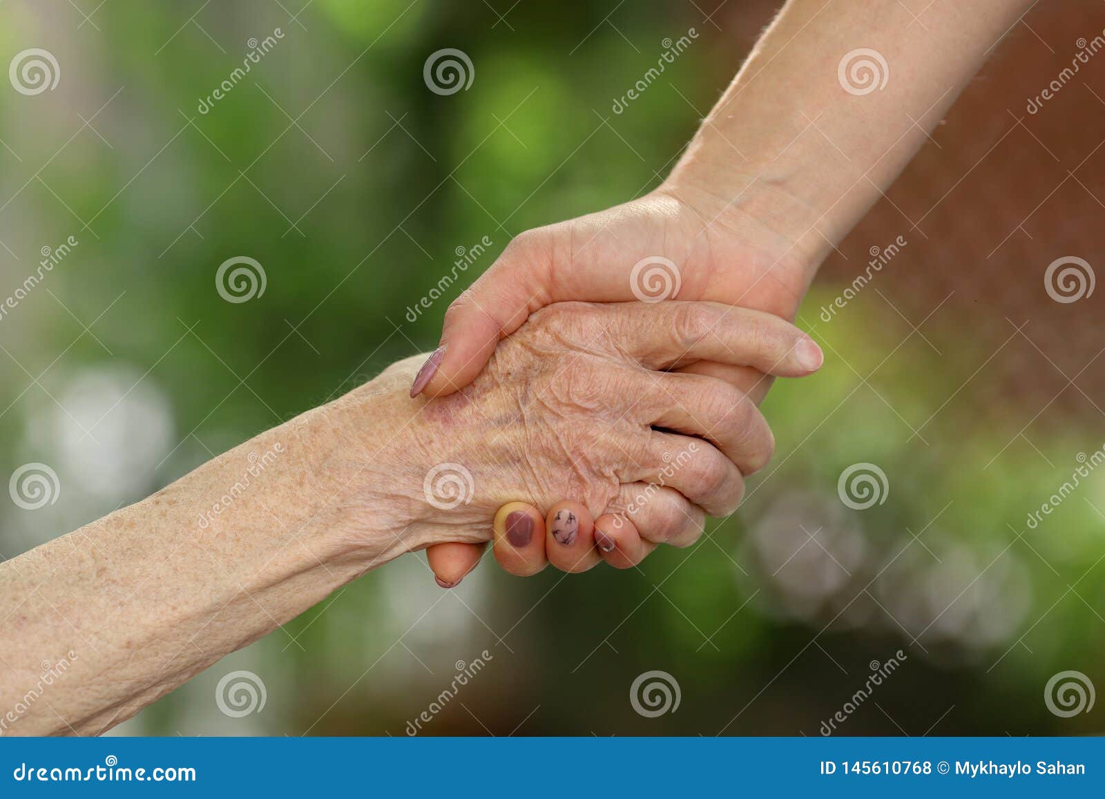 Young Caregiver Holding Seniors Hands. Helping Hands, Care for the ...