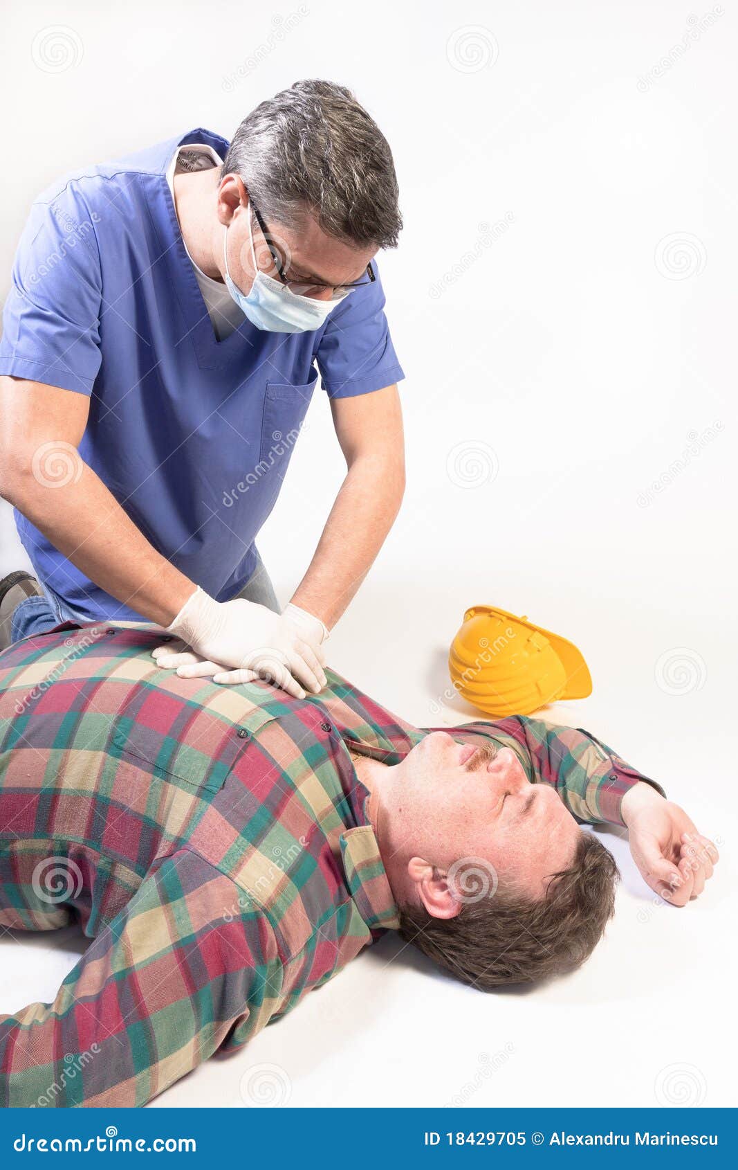 Helping injured man stock image. Image of paramedic, checking - 18429705