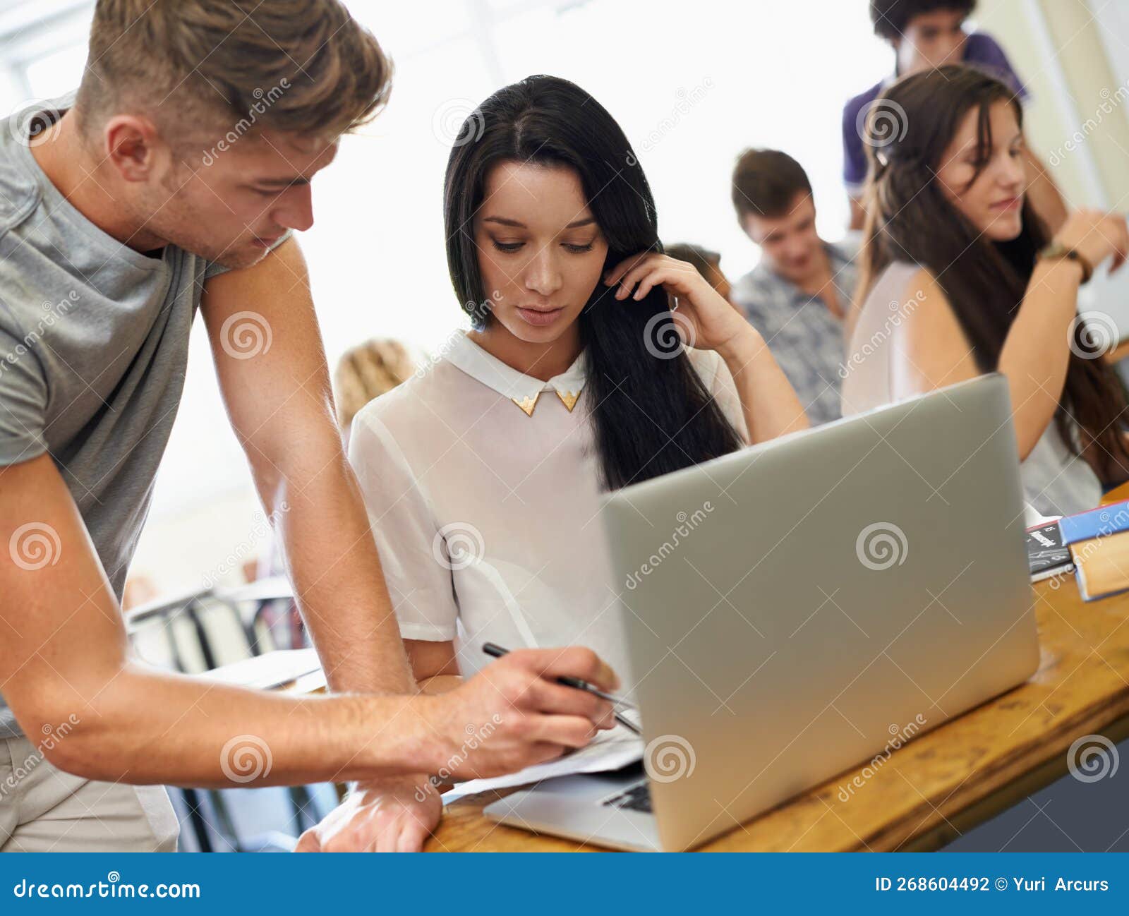 Helping Out a Classmate. Two Students Helping Each Other in a Varsity ...