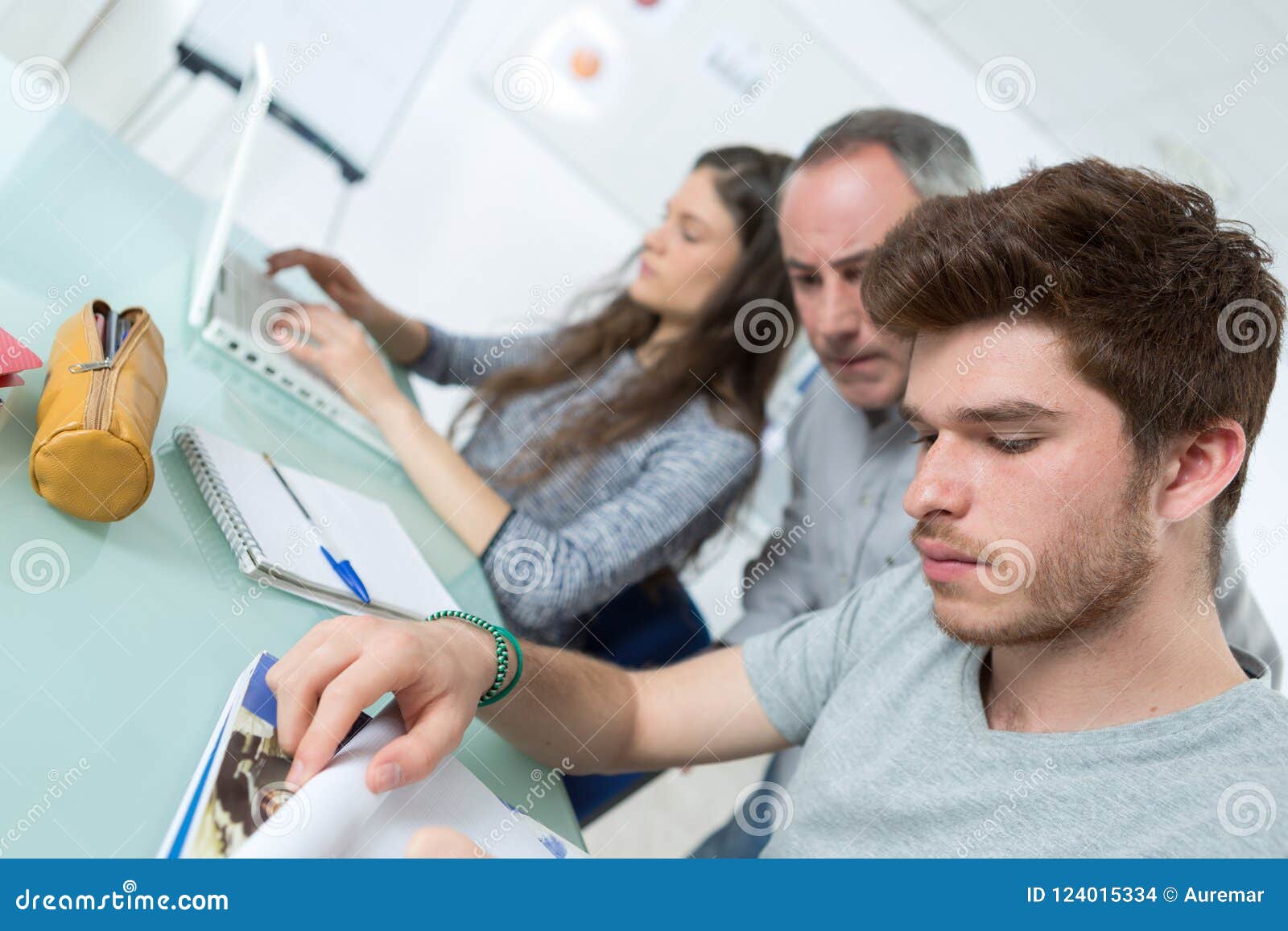 Helping with the project stock photo. Image of working - 124015334