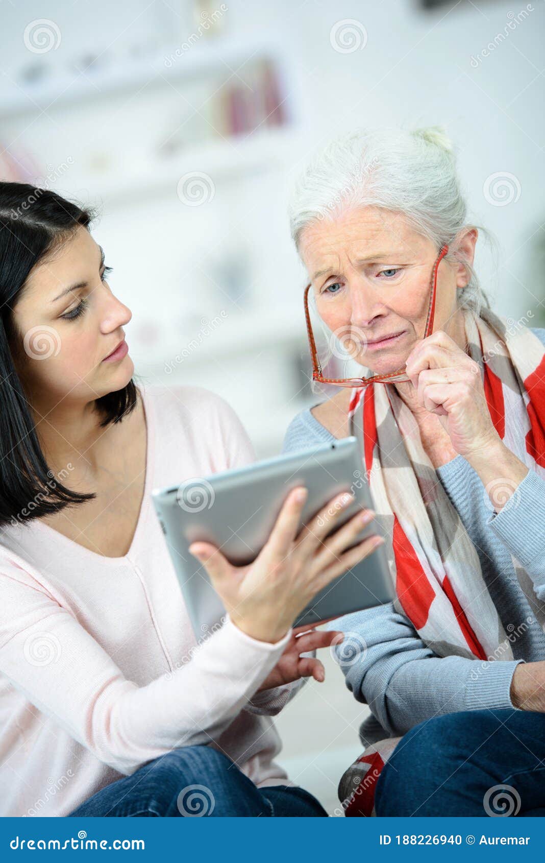 Helping Senior Woman To Read Stock Photo - Image of guidance, pointing ...