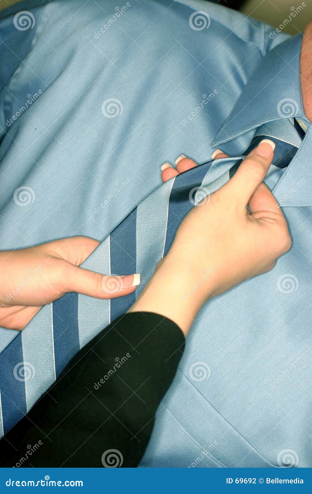 Helping with a tie stock photo. Image of female, suit, dress - 69692