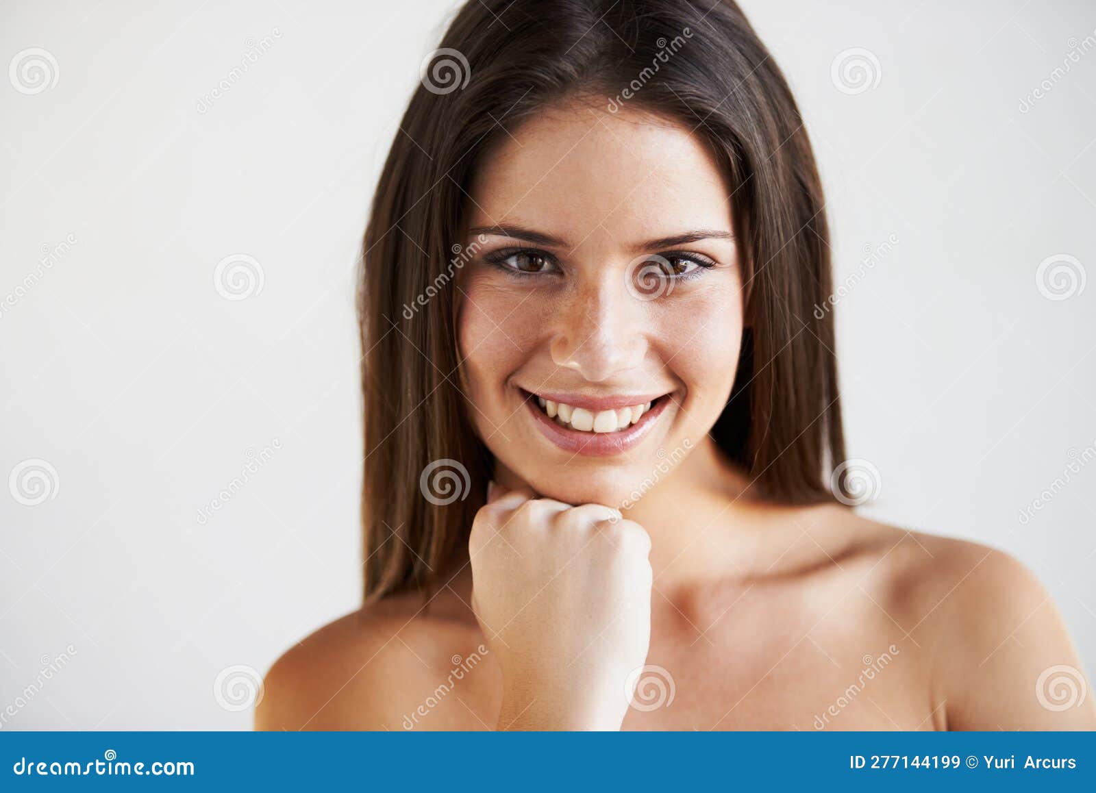 Her Beauty Comes Naturally Portrait Of A Young Woman Standing Against