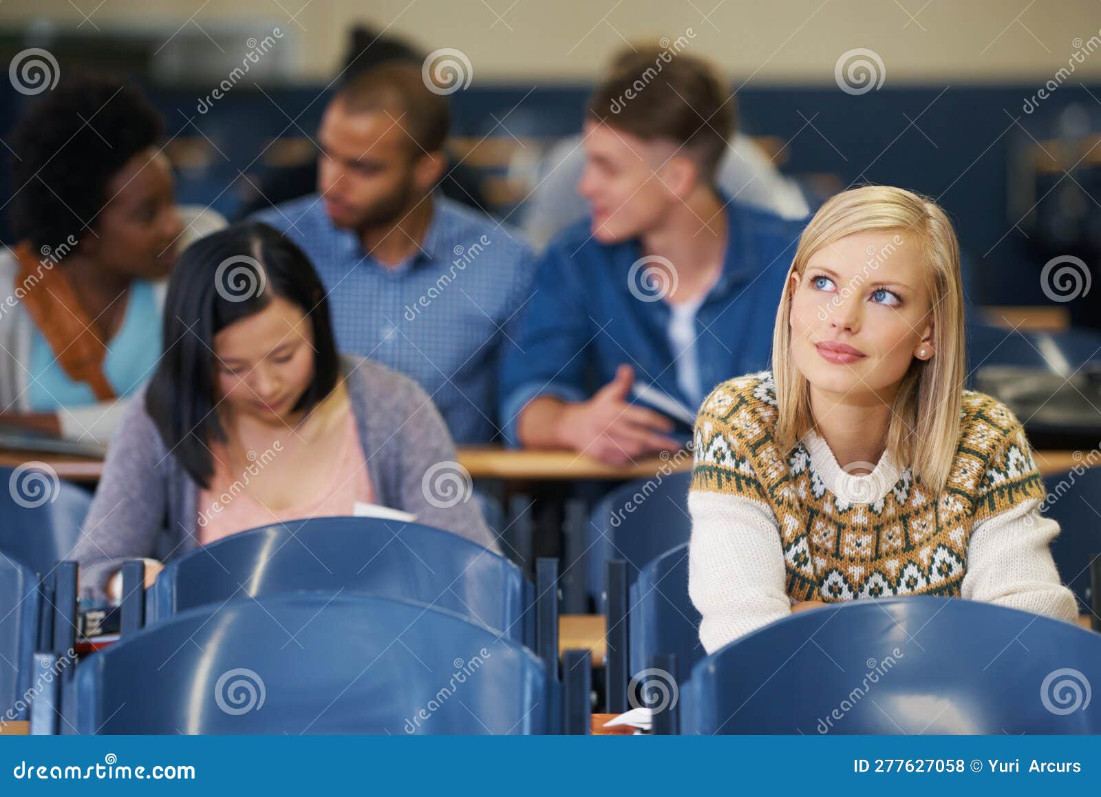 Her Education is Important To Her. a Group of Students Sitting in an ...