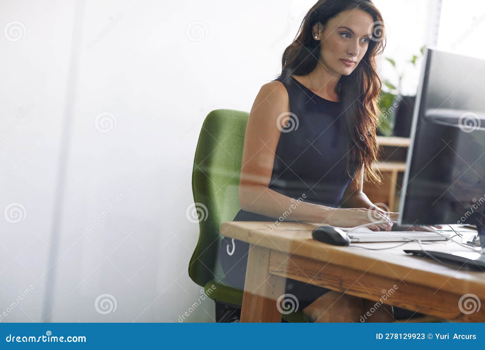 Her Hard Work Will Pay Off. a Young Woman at Work on Her Computer in ...