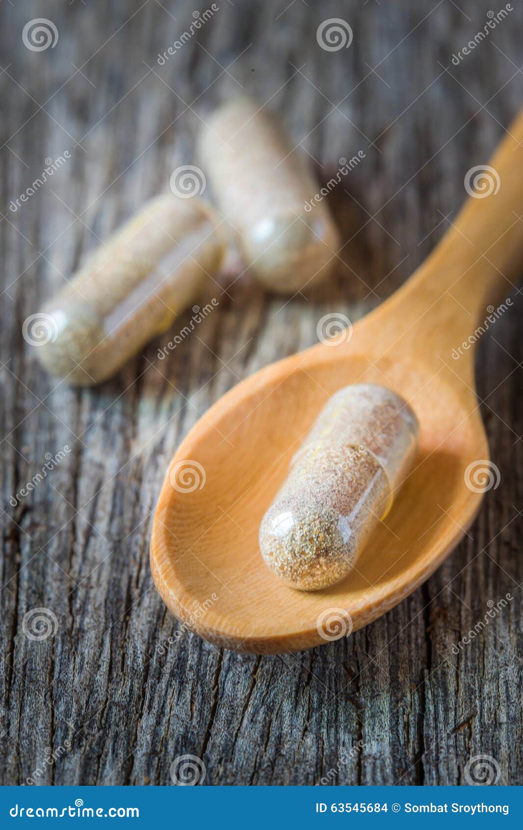 Herb Capsules Spilling in Wooden Spoon. Stock Photo - Image of illness ...